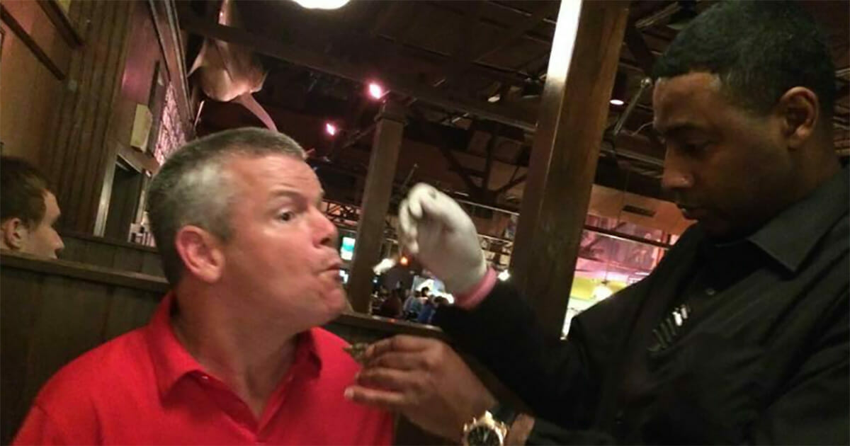 Kind waiter drops everything to feed a man with Cerebral palsy