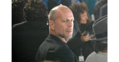 Bruce Willis appears on camera for first time since diagnosis missing tooth