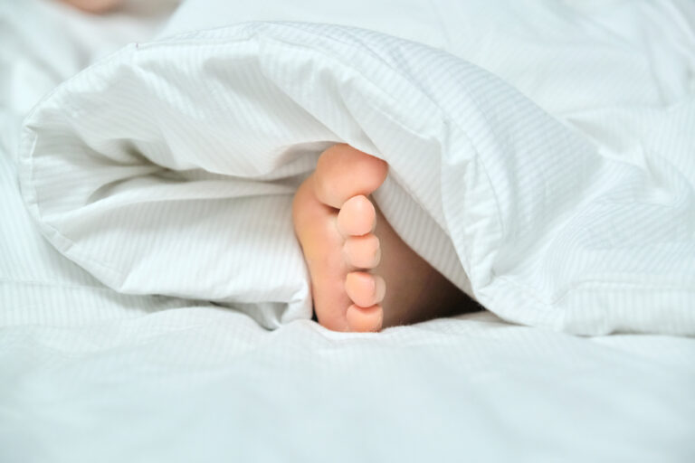 Why sleeping with one foot out might be the key to rest