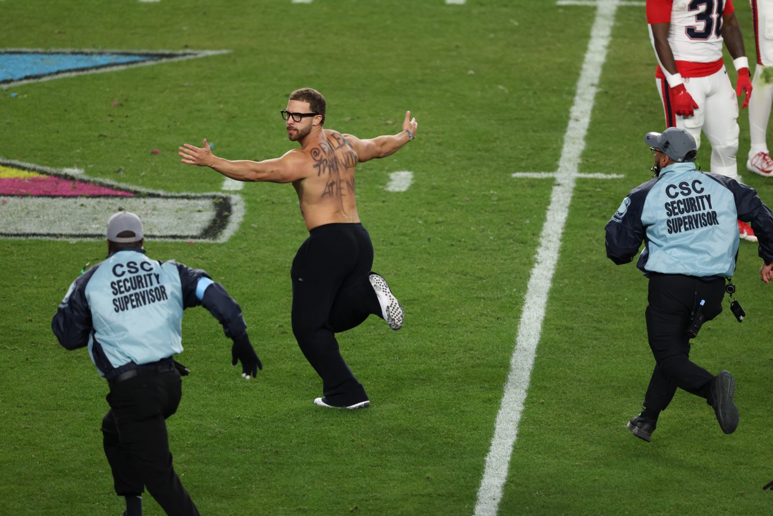 Cryptic message on Super Bowl streaker's back explained
